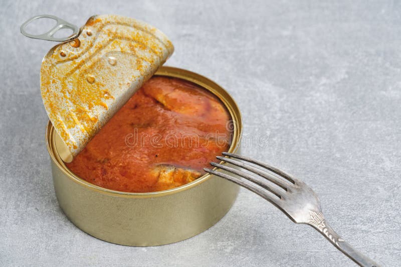 Open Tin Can with Fish in Tomato on Gray Concrete Background. Stock ...