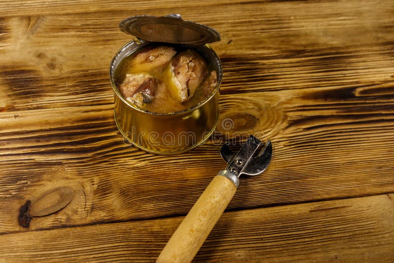 Open Tin Can of Sardine Fish and Can Opener on Wooden Table Stock Photo ...