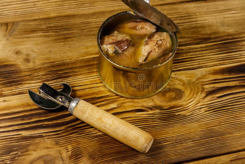 Fish Can with Can Opener on Wooden Table Stock Photo - Image of ...