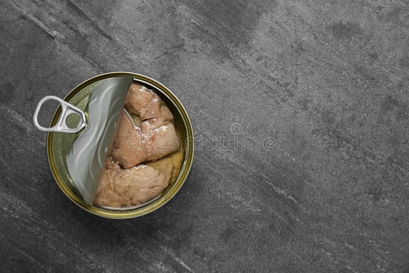 Open Tin Can of Tasty Cod Liver on Black Table, Top View. Space for ...