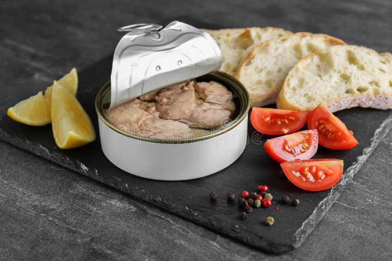 Open Tin Can of Tasty Cod Liver and Different Products on Black Table ...