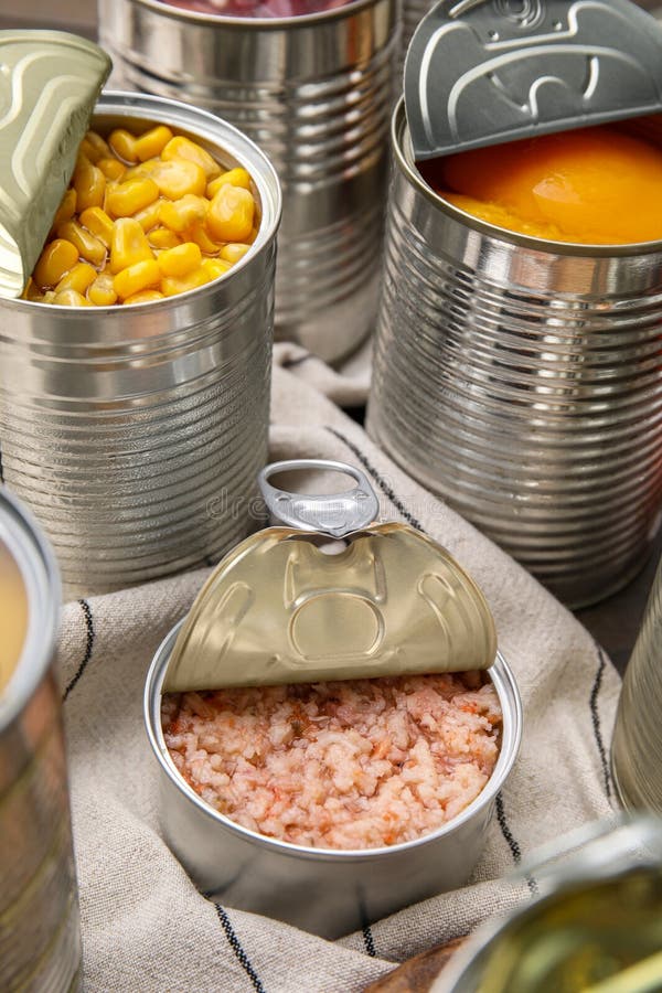 Open Tin Cans with Shrimps and Different Products on Table Stock Photo ...