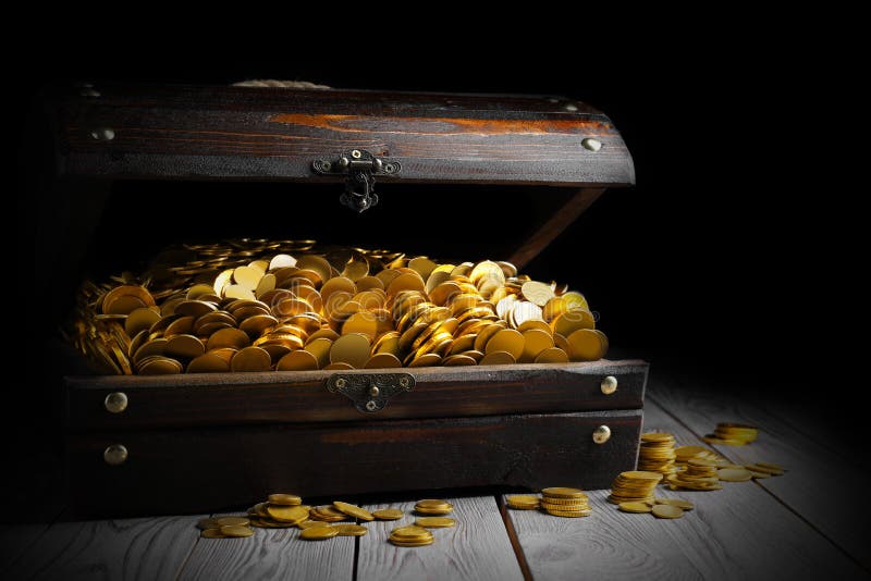 Open Treasure Chest with Gold Coins on Grey Wooden Table Stock Photo ...