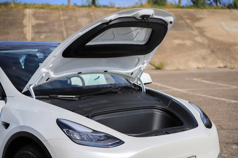 Open Trunk in Front of a White Car Stock Image - Image of electric ...