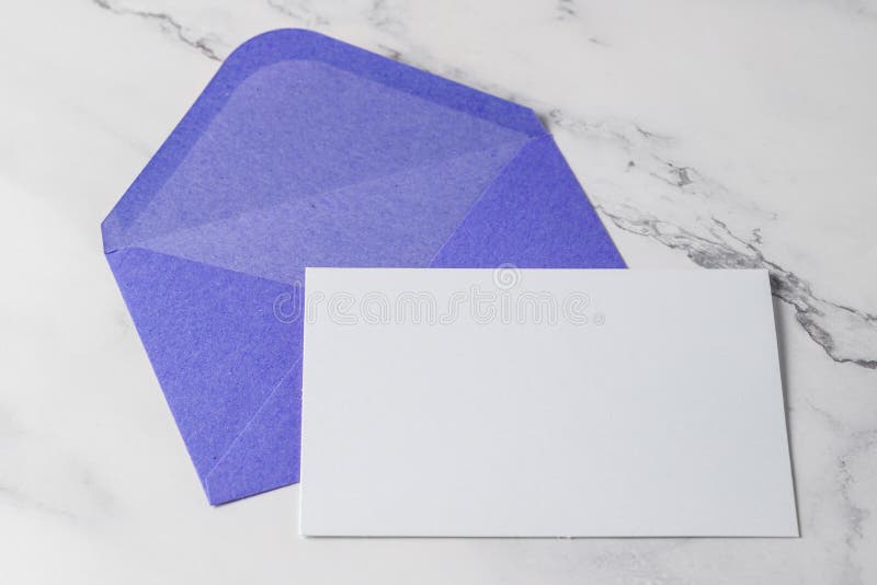 Open Violet Envelope with Blank White Post Card on Light Marble ...
