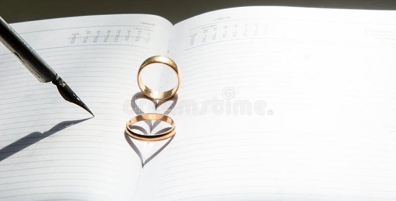 On the Open Weekly are Two Rings. they Create a Heart-shaped Shadow ...