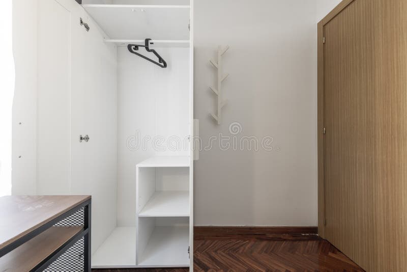 Open White Wardrobe with Shelving, Clothes Stock Photo - Image of ...