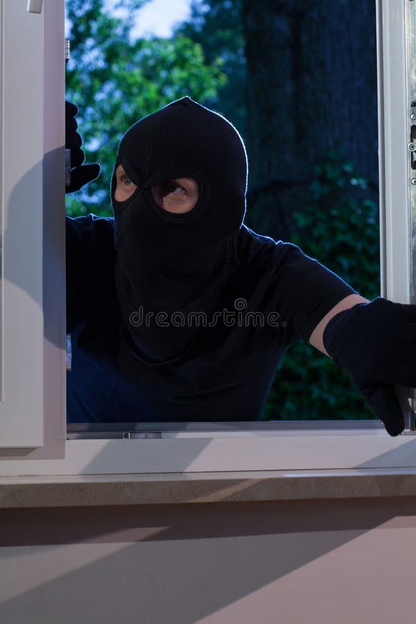 Burglar at a window stock image. Image of mask, hold - 45220441