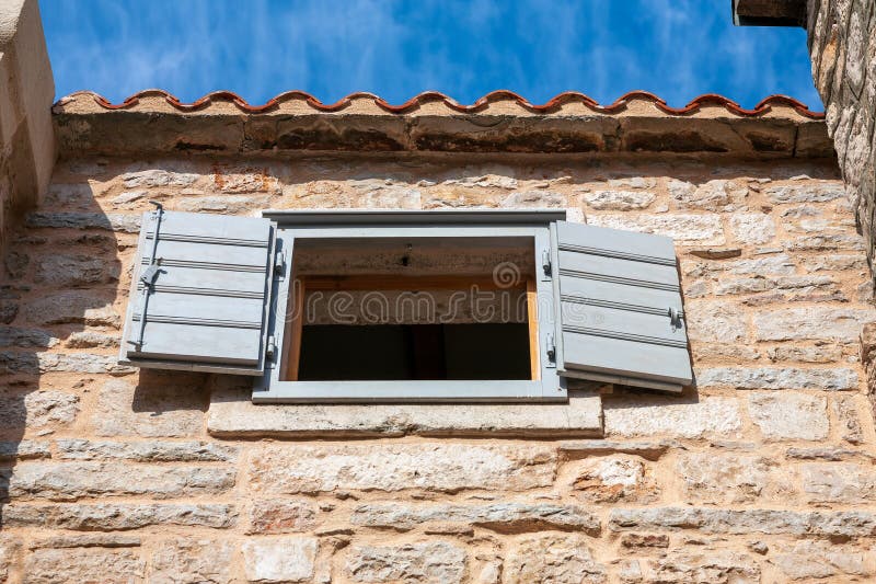 Open Window with Wooden Shutters on Rustic Wall Stock Image - Image of ...
