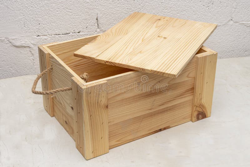 Open Wooden Box with a Lid Made of Boards with a Rope Handle, on a ...