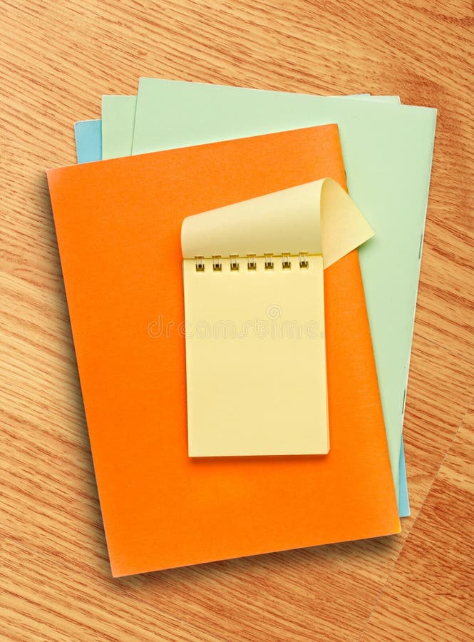 Open Yellow Notepad on Colored Paper Stock Image - Image of open ...