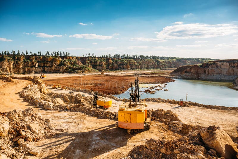 Opencast Mining Quarry with Machinery at Work. Digging Equipment ...