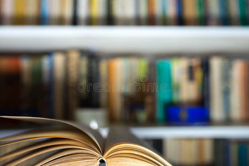 Opened , Aged, Yellow Book Pages in Front of a Book Shelf Stock Image ...