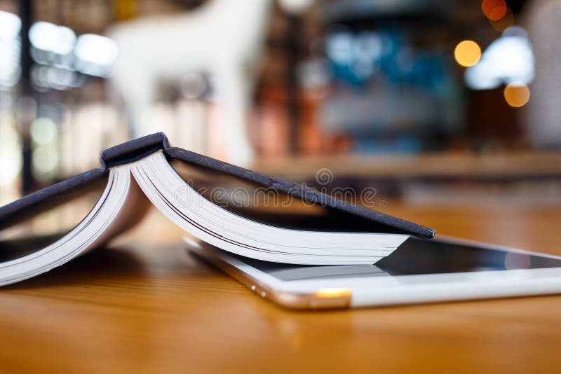 Opened Book Above the Tablet Stock Photo - Image of focus, mobile ...
