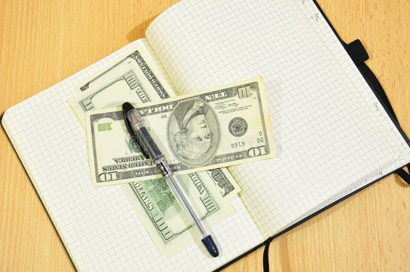 Money in notebook stock photo. Image of visible, notepad - 30323494