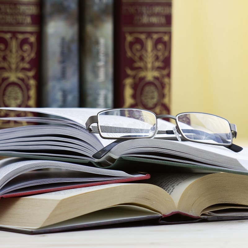 Opened books and glasses stock image. Image of book, bookstore - 18302247