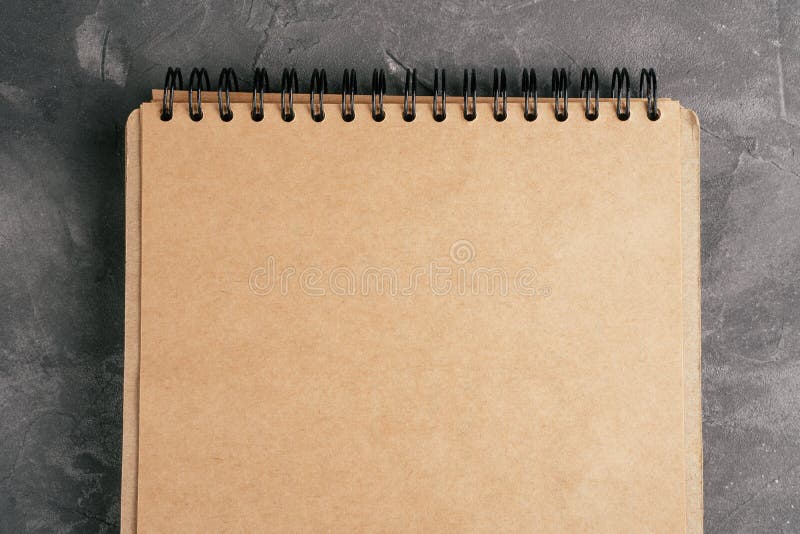 Opened Brown Kraft Paper Notebook on Spring on Gray Concrete Surface ...