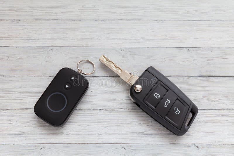 Opened Car Key with Remote Control on Wooden Background, Close-up Stock ...