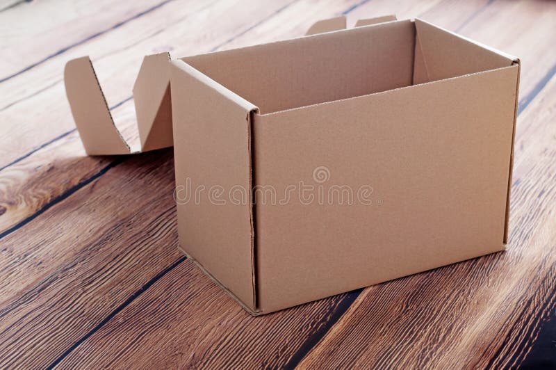 Brown Carton Box Laying on Sheets of Crumpled Kraft Paper Stock Photo ... Brown Carton Box Laying on Sheets of Crumpled Kraft Paper Stock Photo ...