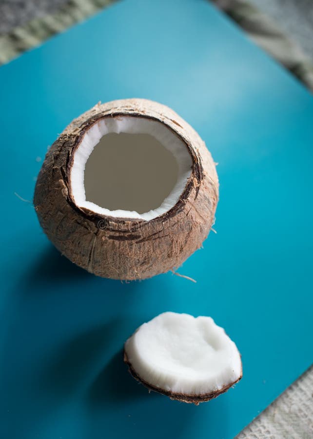 Coconut on blue color stock photo. Image of shell, studio - 109990156