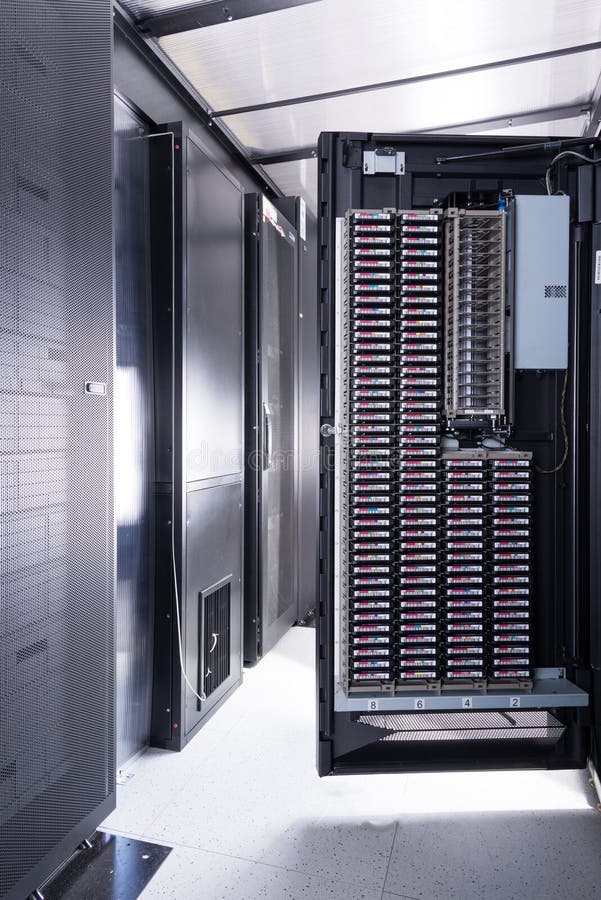 An Opened Door of Data Center Cabinet Filled with Data Storage H Stock ...