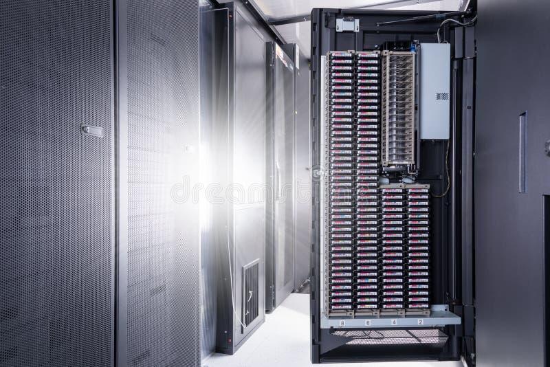 An Opened Door of Data Center Cabinet Filled with Data Storage H Stock ...