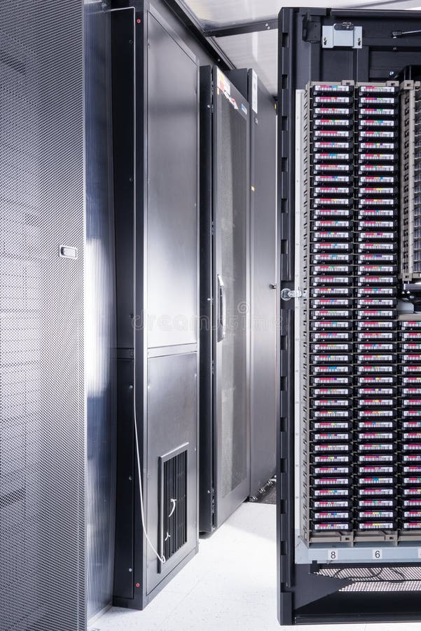 An Opened Door of Data Center Cabinet Filled with Data Storage Hardware ...