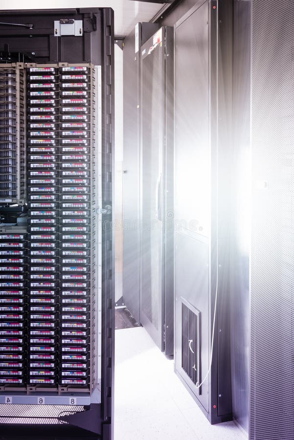 An Opened Door of Data Center Cabinet Filled with Data Storage Hardware ...