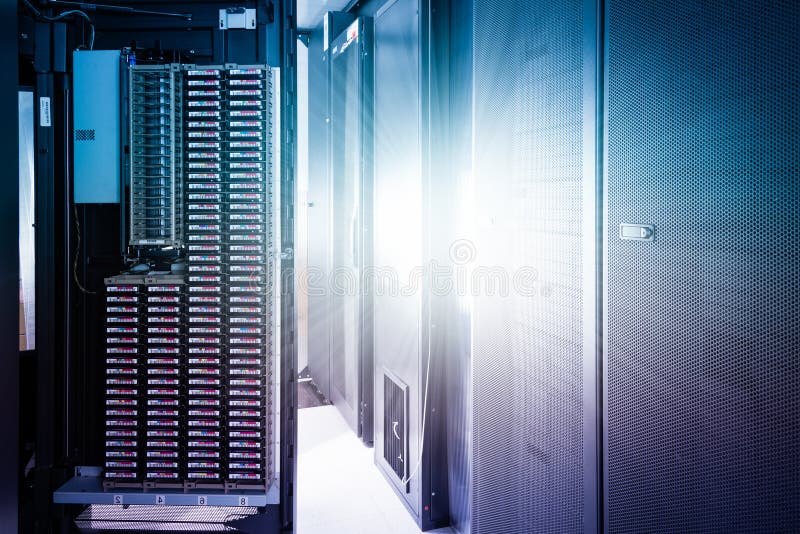 An Opened Door of Data Center Cabinet Filled with Data Storage H Stock ...