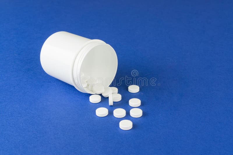 Opened Drug Can with Tablets on a Blue Background Stock Image - Image ...