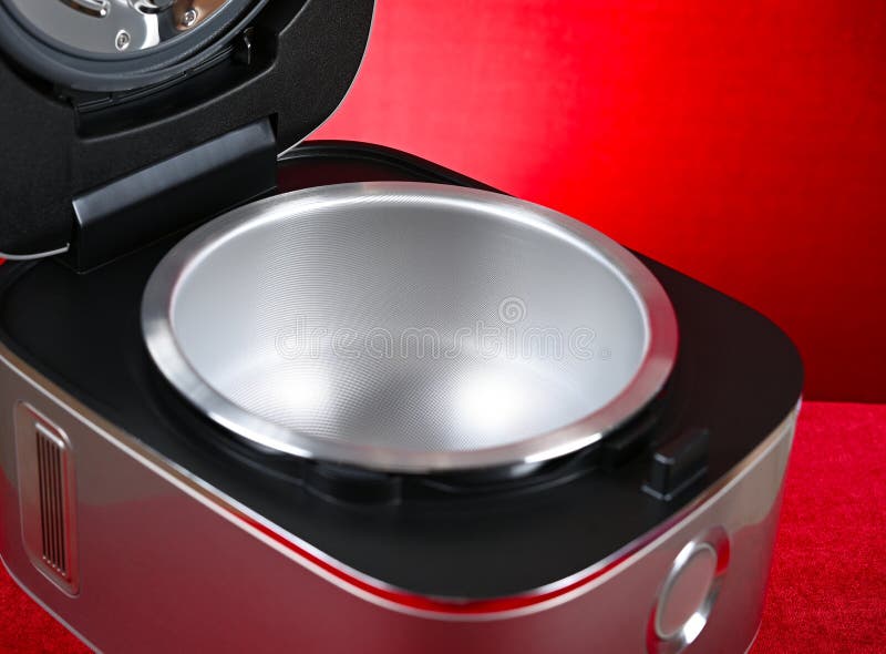 An Opened Electric Rice Cooker on Red at Horizontal Composition Stock ...