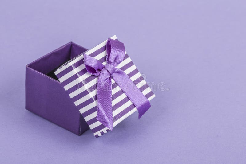 Opened gift box on purple stock image. Image of wrapped - 83250463