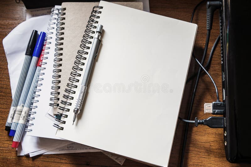 Opened Notebook with Pencil, Marker Pen and Laptop on Working Table ...