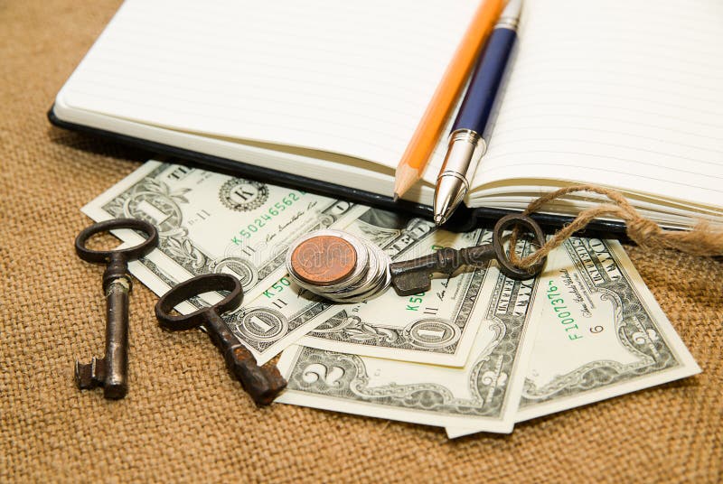Opened Notebook, Pencil, Pen, Key and Money on the Old Tissue Stock ...