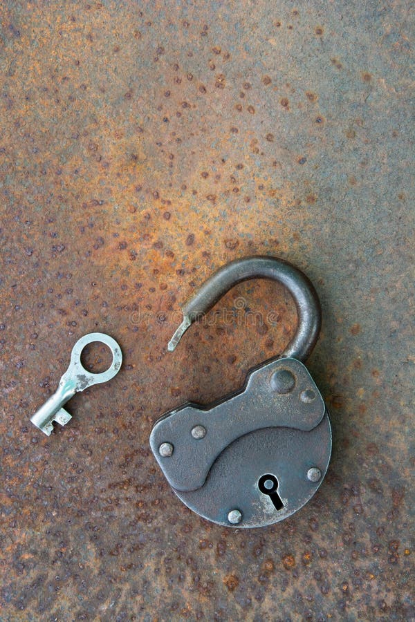 Opened Old Rusty Lock with Key Lying Near on the Rusty Iron Surface ...