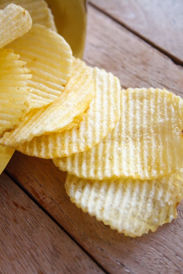 Opened Pack with Potato Chips Over Table Stock Photo - Image of ...