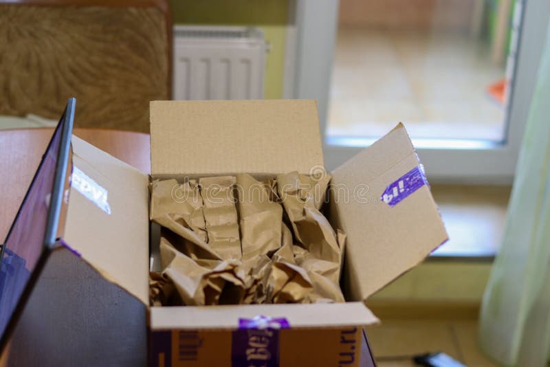 Opened Packaging from the Mail. Delivery of Things Home. Box on the ...