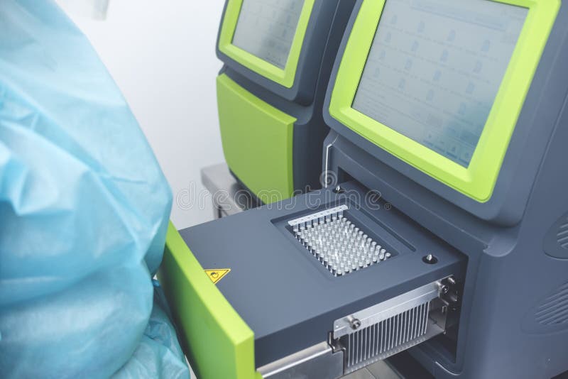 An Opened PCR Machine, Revealing the PCR Plate and Tubes Filled with ...