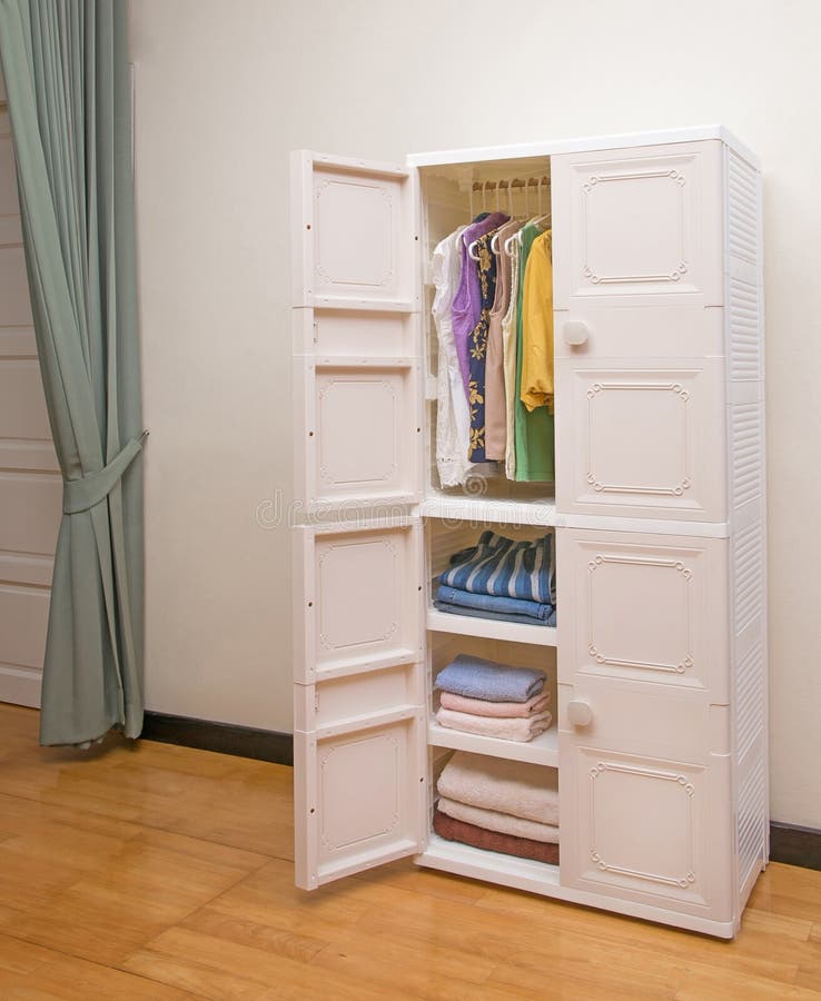 Opened Plastic Wardrobe With Clothing In Bedroom Stock Photo Image Of ...
