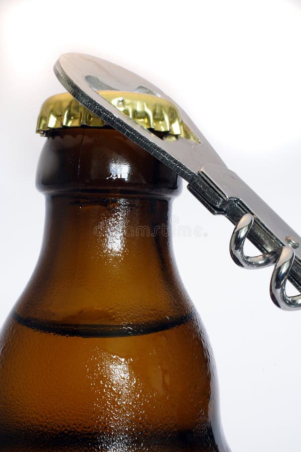 Opening a beer stock image. Image of isolated, beverage - 1057585