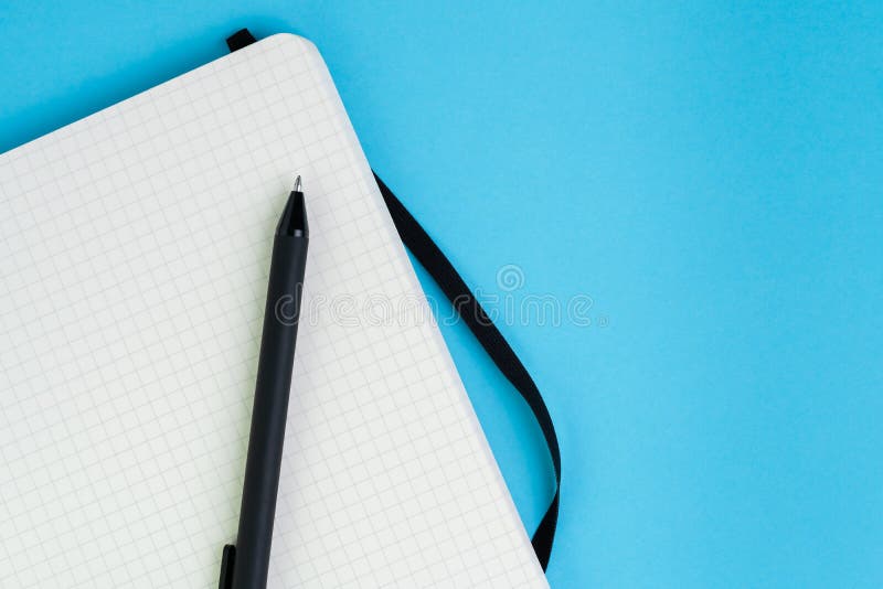 Opening Blank Graph Paper Page Notebook with Pen on Solid Yellow ...