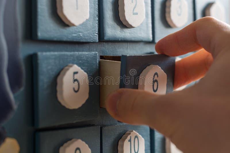 Opening a Blue Advent Calendar Close Up from the Side Stock Photo ...