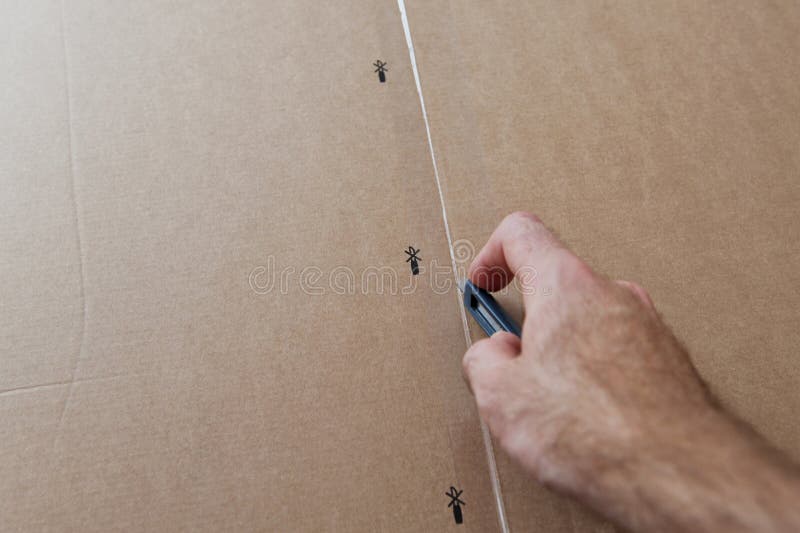 Opening a cardboard box stock image. Image of adult, floor - 28974979