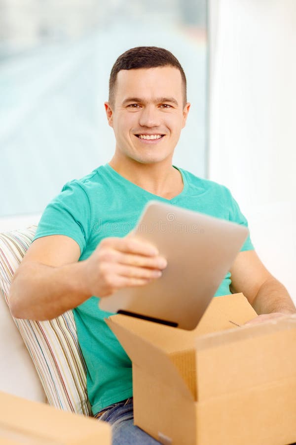 Opening Cardboard Box and Taking Out Tablet Pc Stock Photo - Image of ...