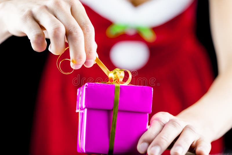 Opening christmas present stock image. Image of xmas - 34087257