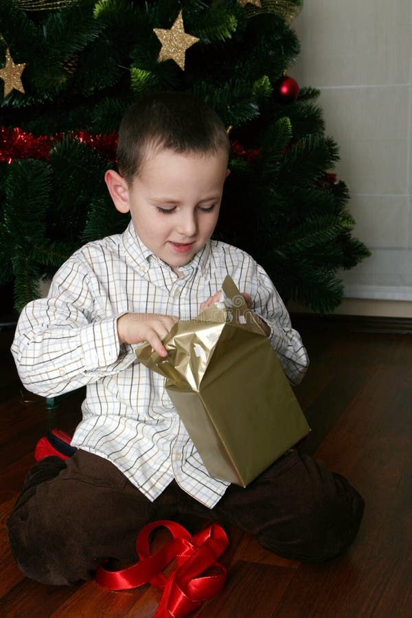 Opening Christmas presents stock photo. Image of offering - 11324574