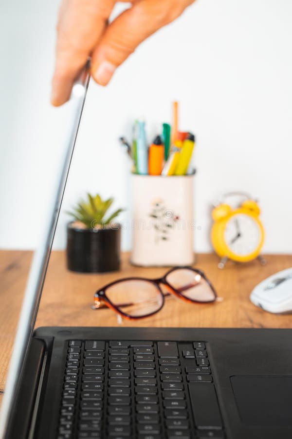 Opening Computer Notebook on Office Desk, Concept, Starting Work ...