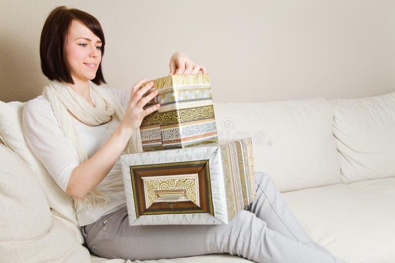 Opening gifts stock image. Image of couch, excitement - 9386011