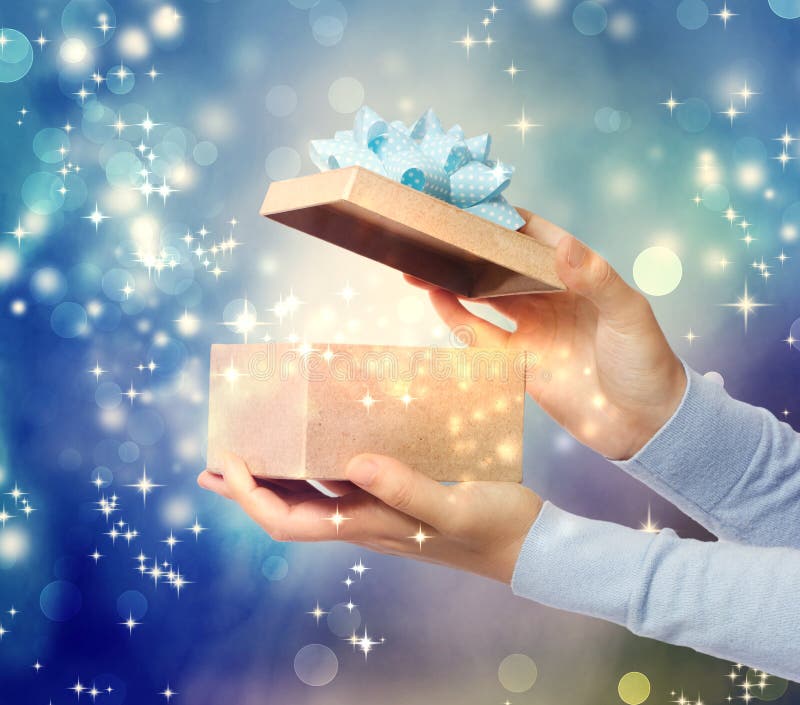 Opening a Special Gift stock image. Image of blue, giving - 43401013