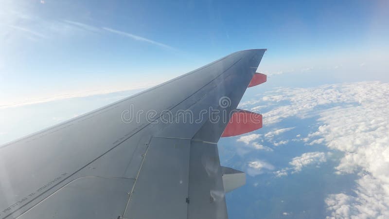 Opening of the Window. the Wing of an Aircraft in the Sky with Clouds ...